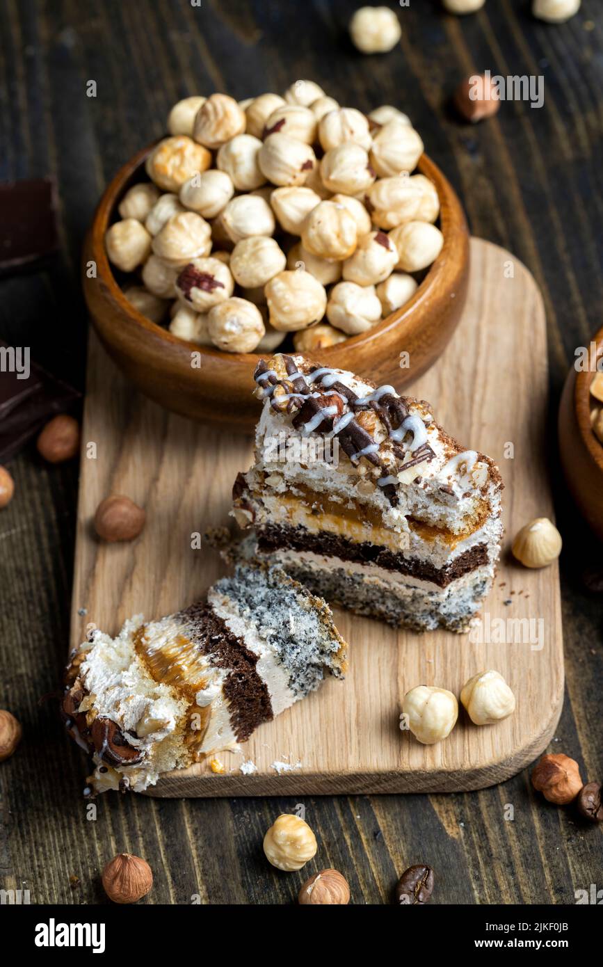 multi-layer cake with different layers, caramel, poppy seeds and cream ...