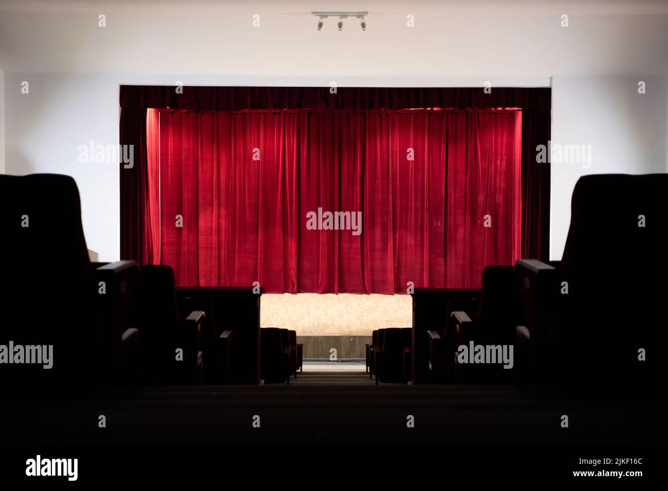 Theater curtain and stage with dramatic lighting Stock Photo - Alamy