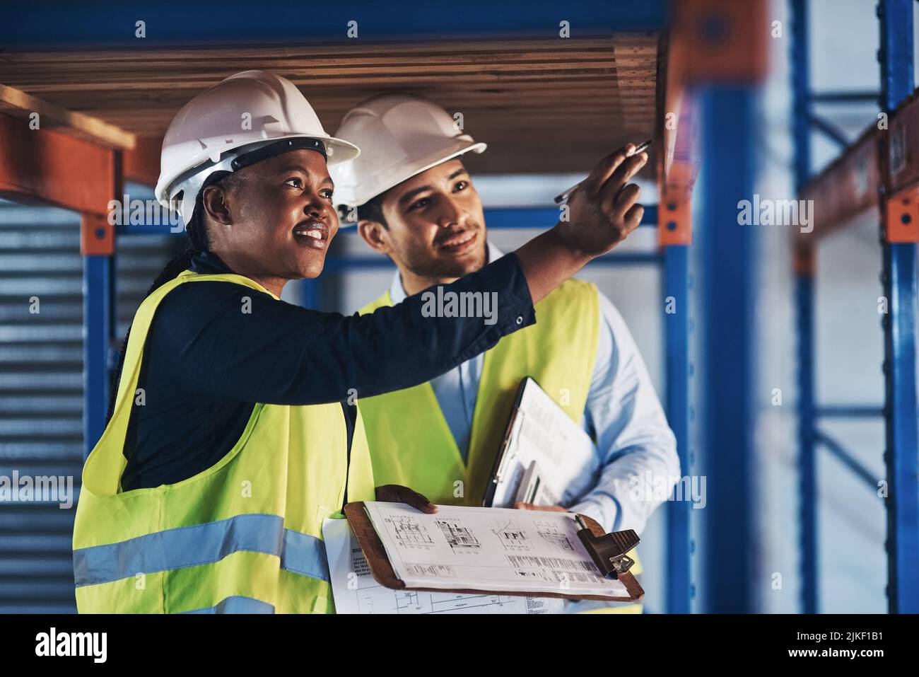 What about this. two young contractors standing together and examining ...