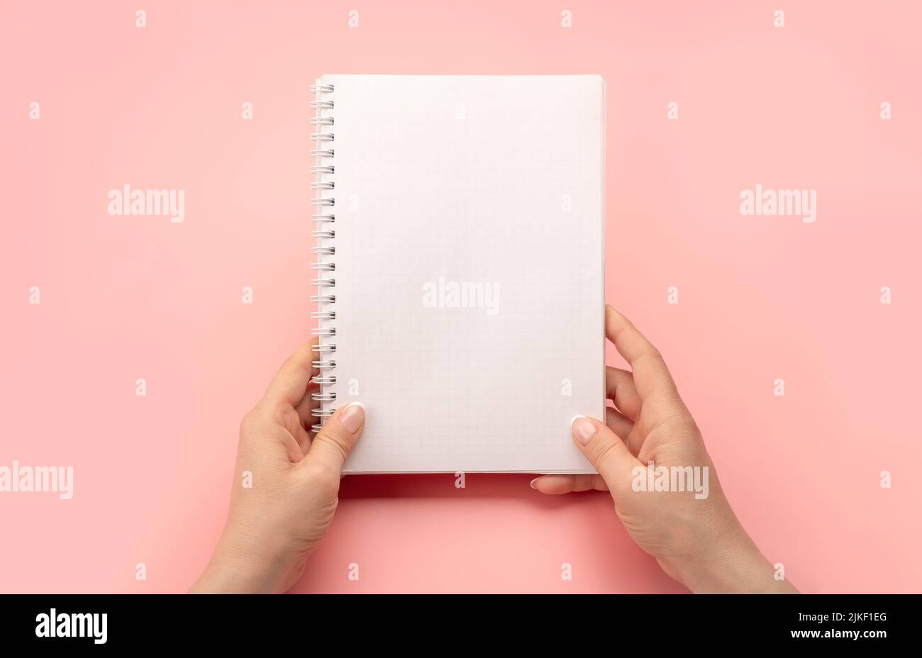 Notepad mockup. female hands holding blank spiral notepad or calendar ...