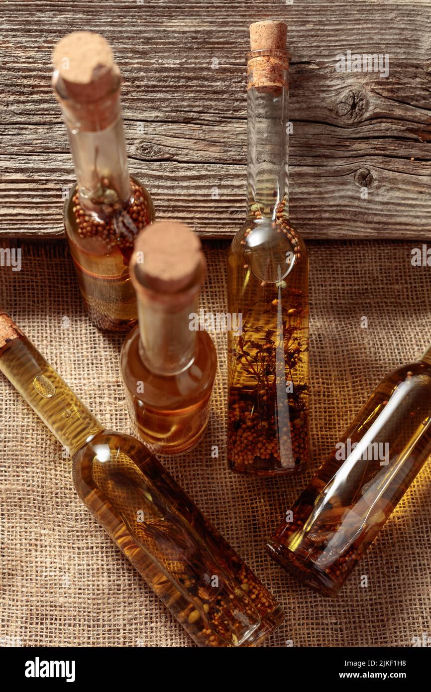 Homemade olive oil with herbs and spices in small bottles. Selective ...