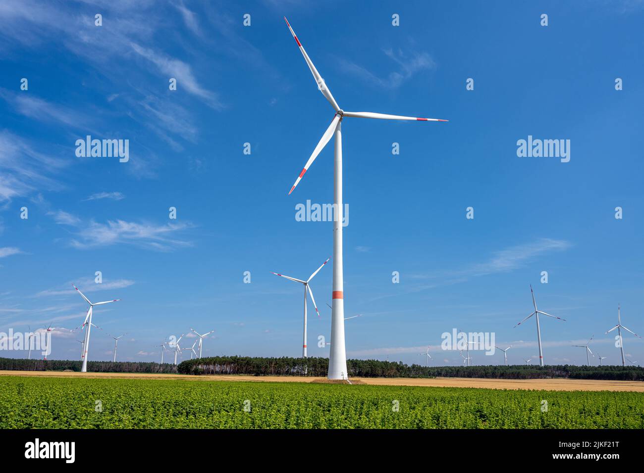 Wind energy plants in front of a blue sky in Germany Stock Photo - Alamy