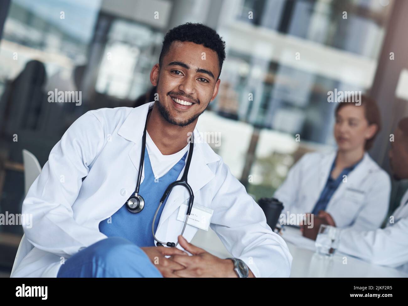 Being a doctor is my calling. a young male doctor taking a break from ...
