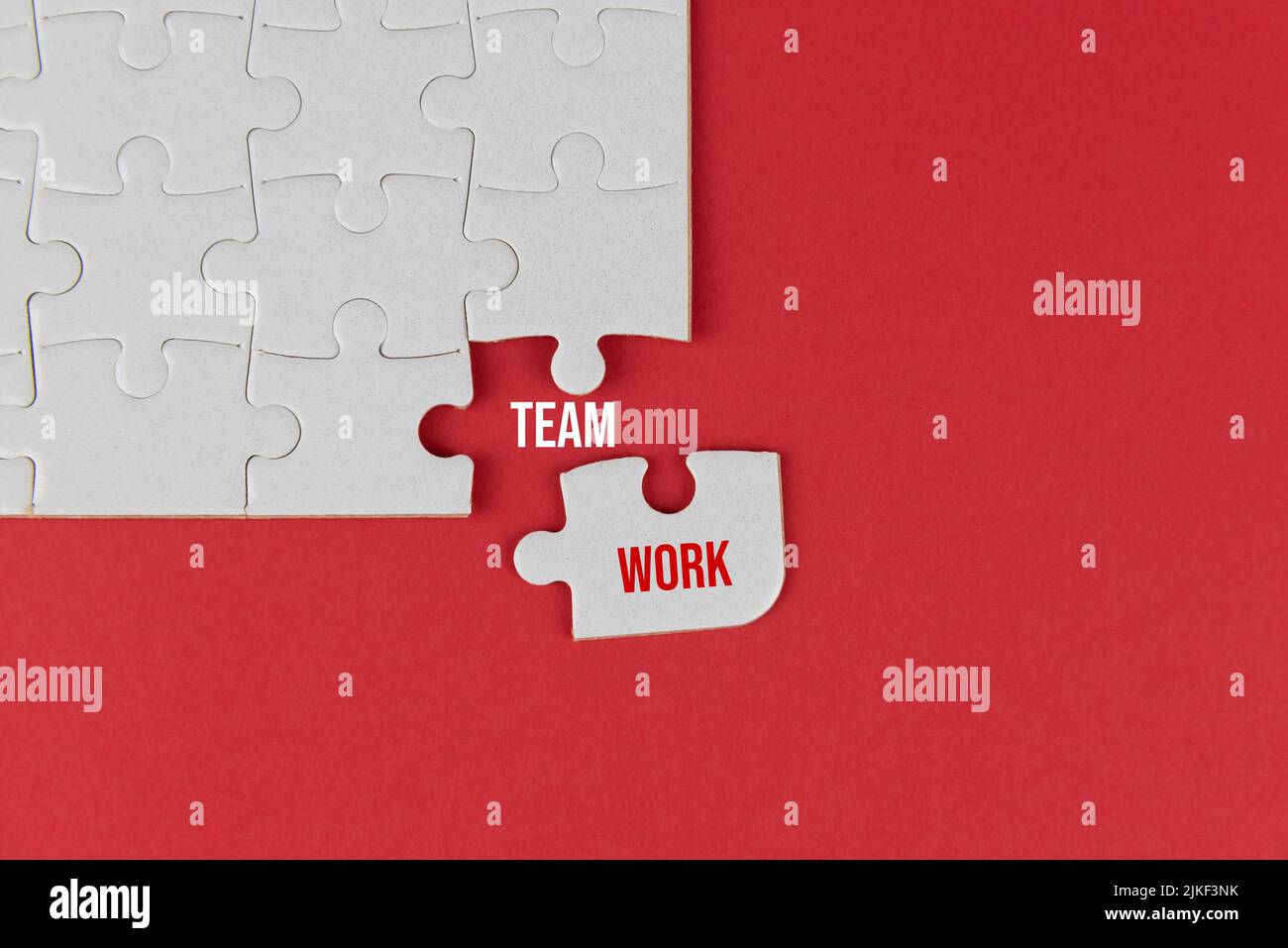 White jigsaw puzzle with missing piece on red background. Business ...