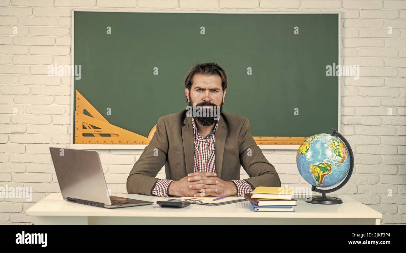 man with beard and moustache look as businessman or teacher in college ...