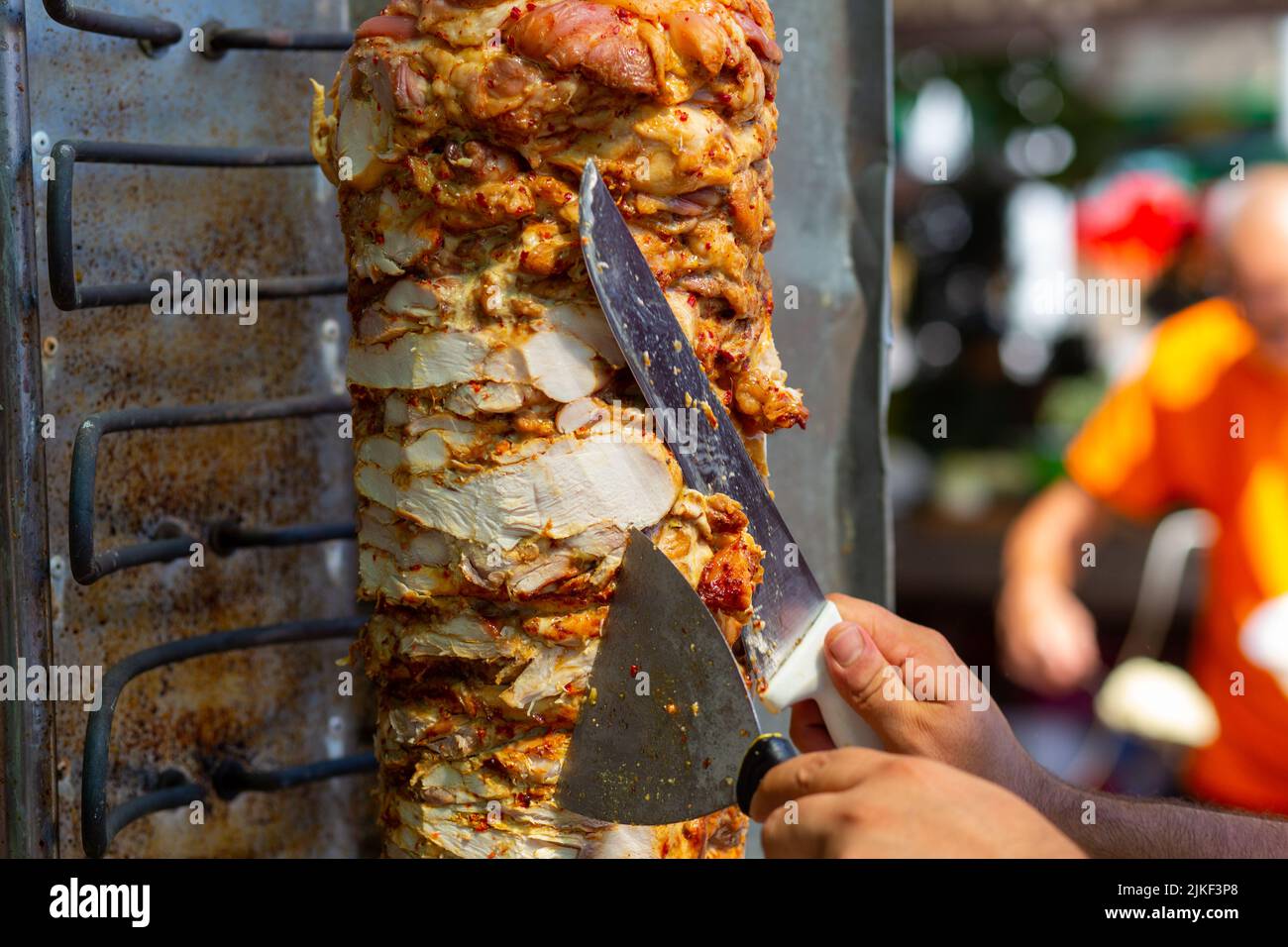 Chef cutting with doner knife Traditional Turkish Doner Kebab meat ...