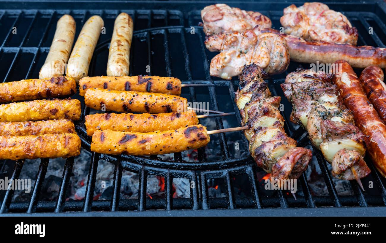 vegan food on the left side, meat on the right side, barbecue for ...