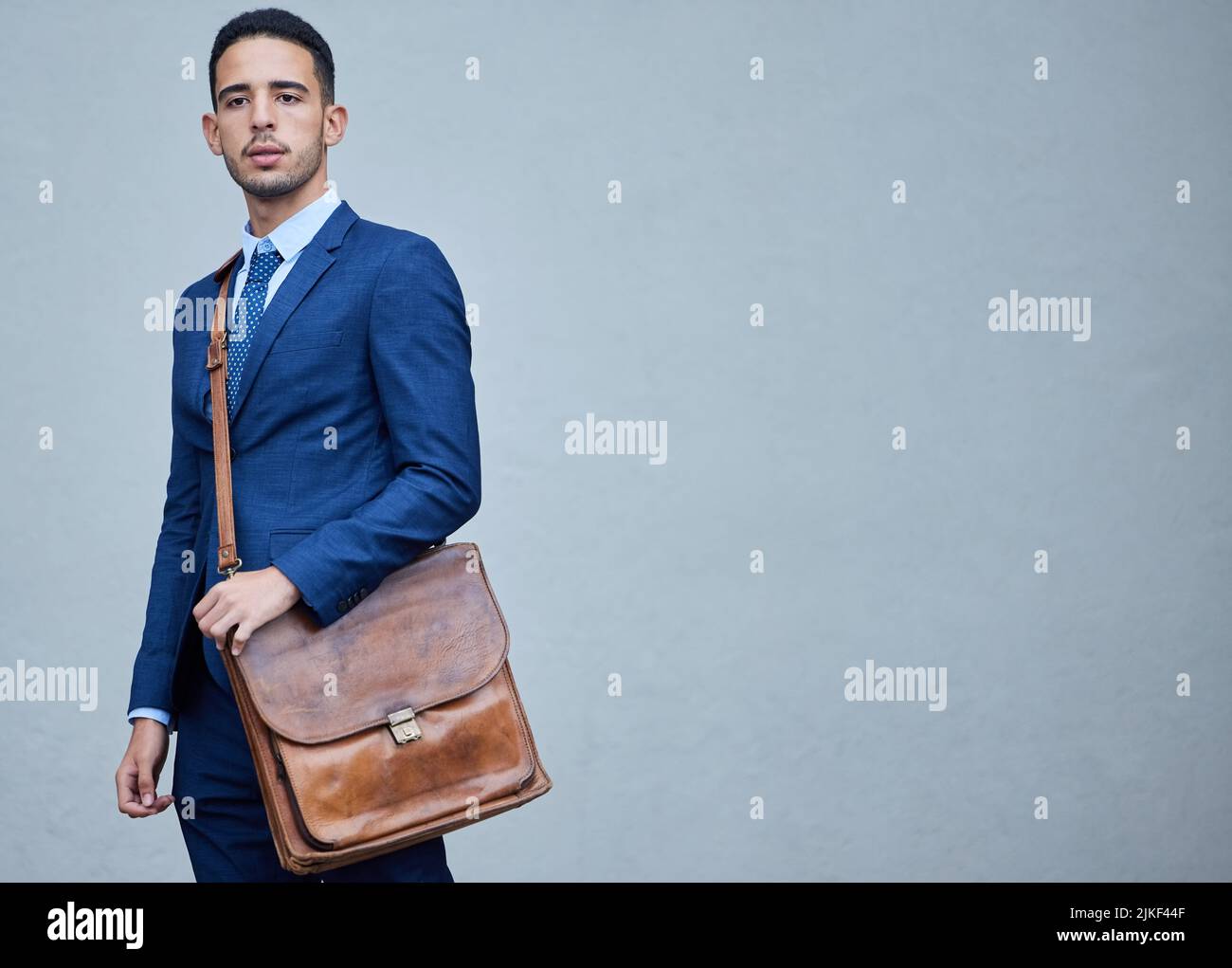 Man walking with satchel hi-res stock photography and images - Alamy