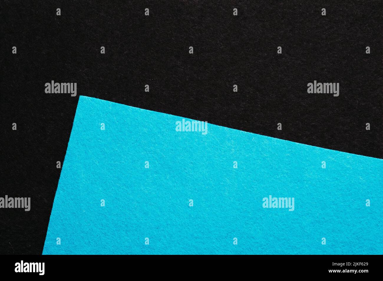 sky blue felt texture angled sheet dark background Stock Photo - Alamy