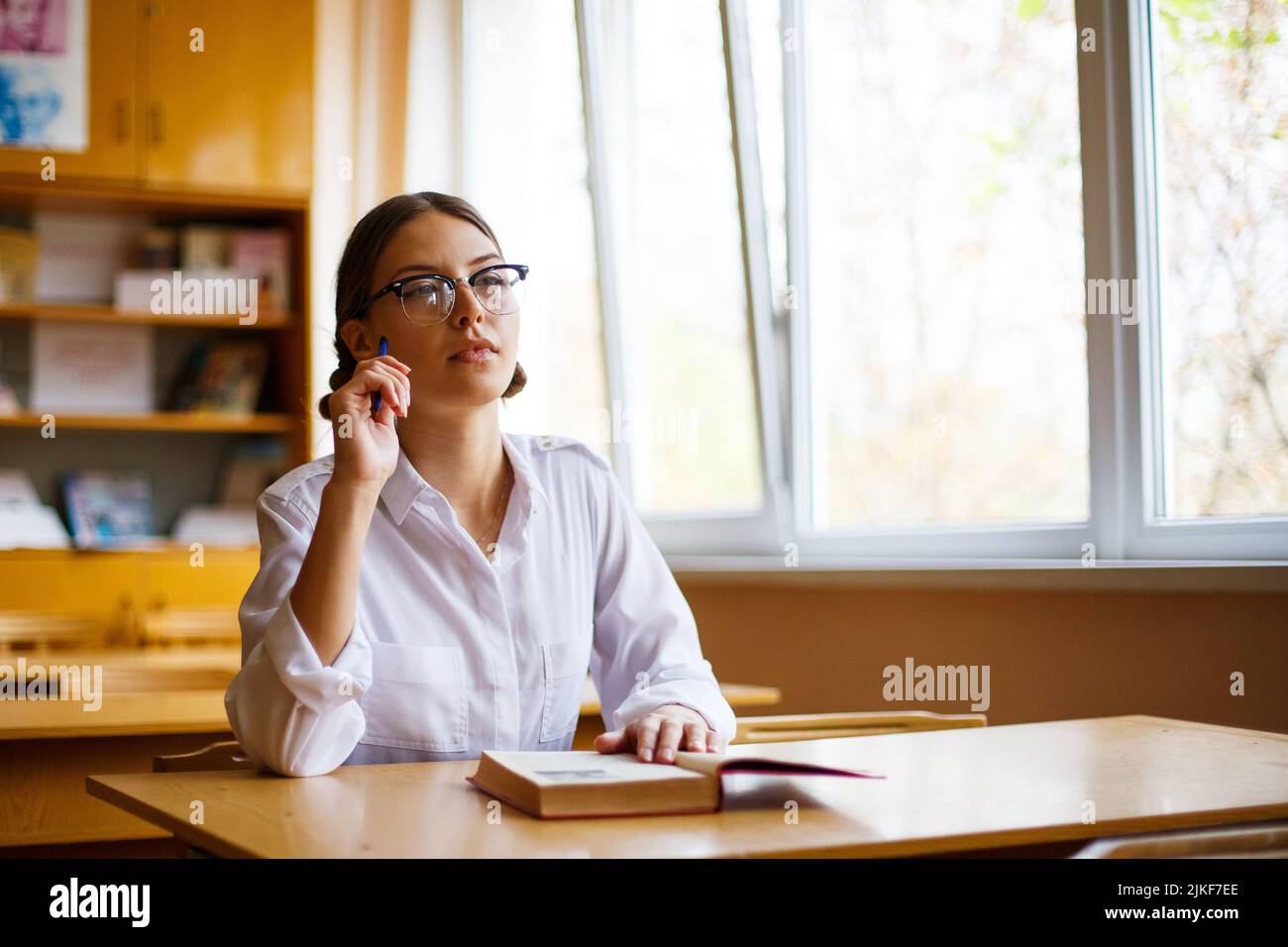 Education in classroom concept image student writing article or notes ...