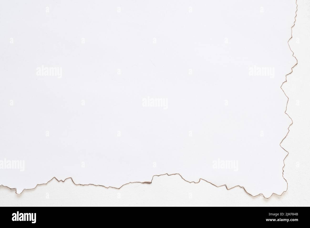 torn paper white background burnt edge design Stock Photo - Alamy