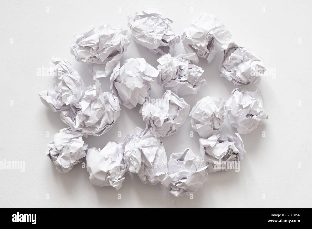 waste crumpled paper ball pile white background Stock Photo - Alamy
