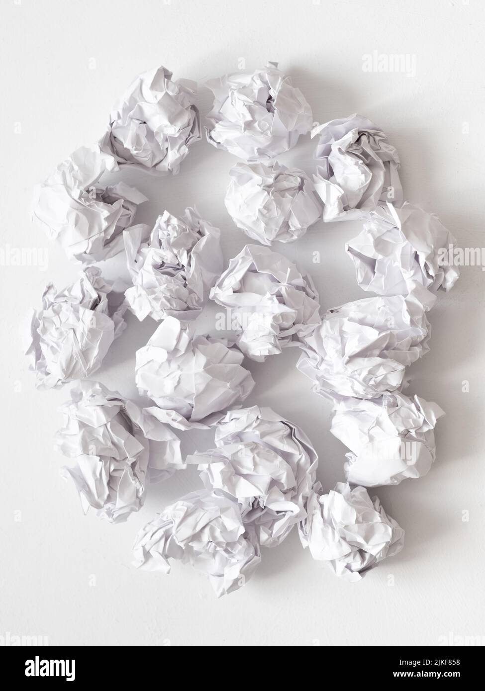 waste reduction paper ball pile white background Stock Photo - Alamy