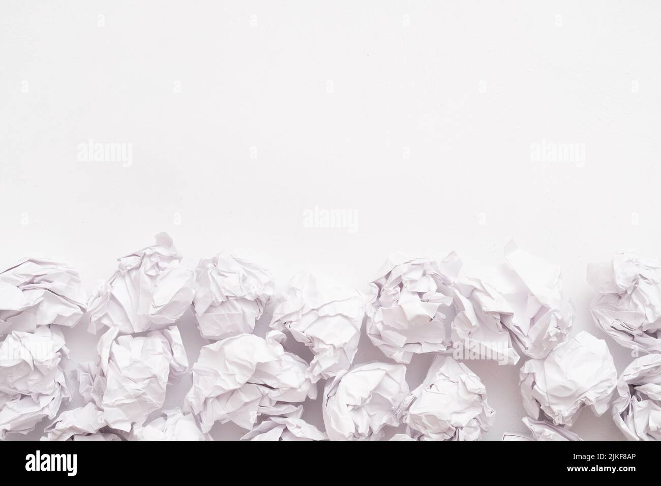 creative block paper ball pile white background Stock Photo - Alamy