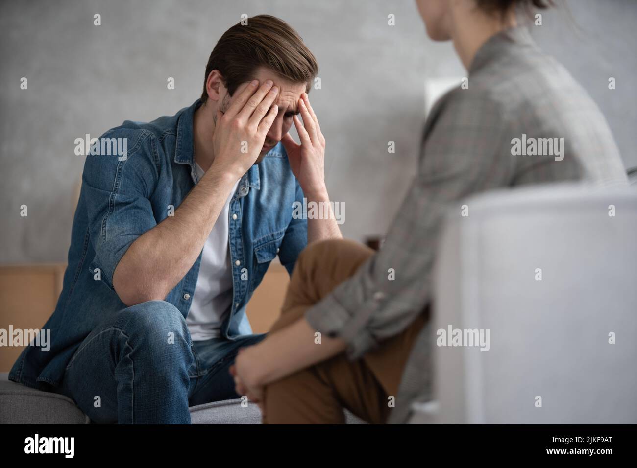 Psychologist talking with patient on therapy session Stock Photo - Alamy