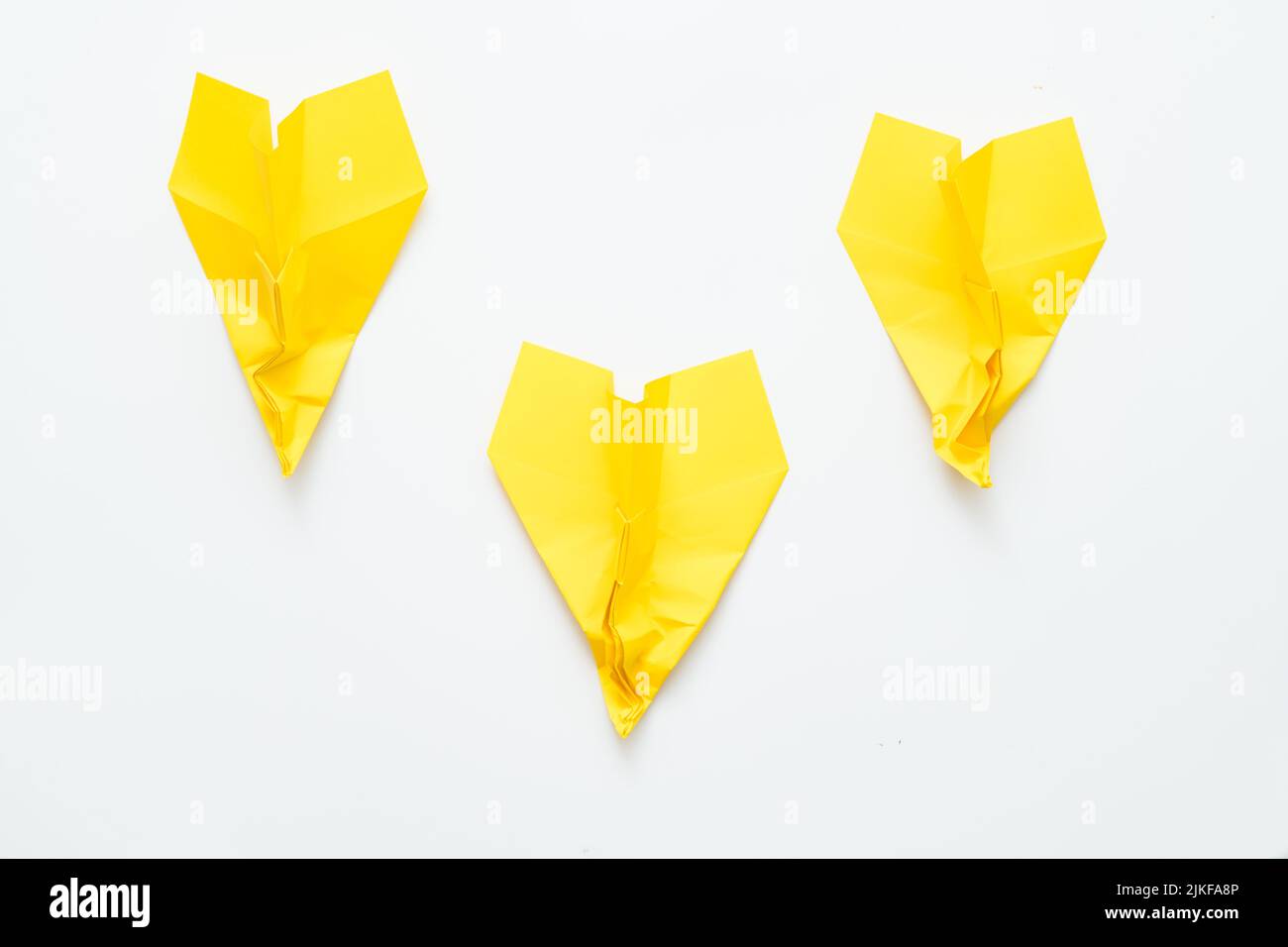 business failure yellow crumpled paper airplanes Stock Photo - Alamy
