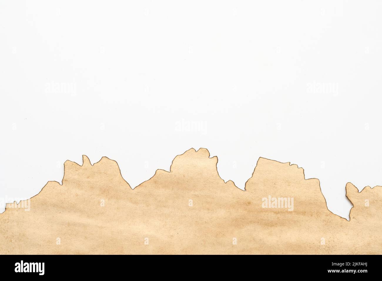 torn ancient style beige paper burnt edge antique Stock Photo - Alamy