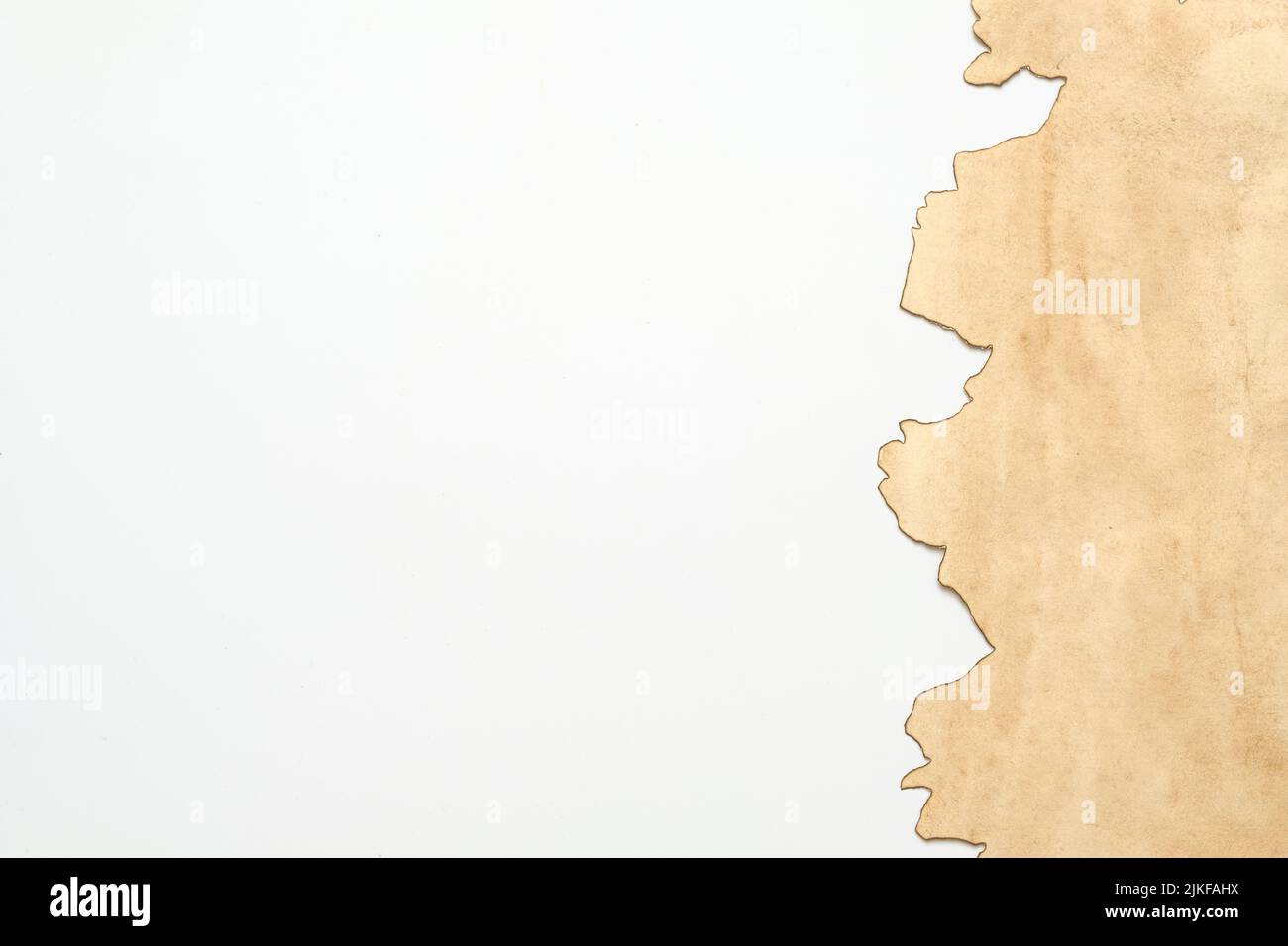 papyrus style beige paper piece burnt edge ancient Stock Photo - Alamy