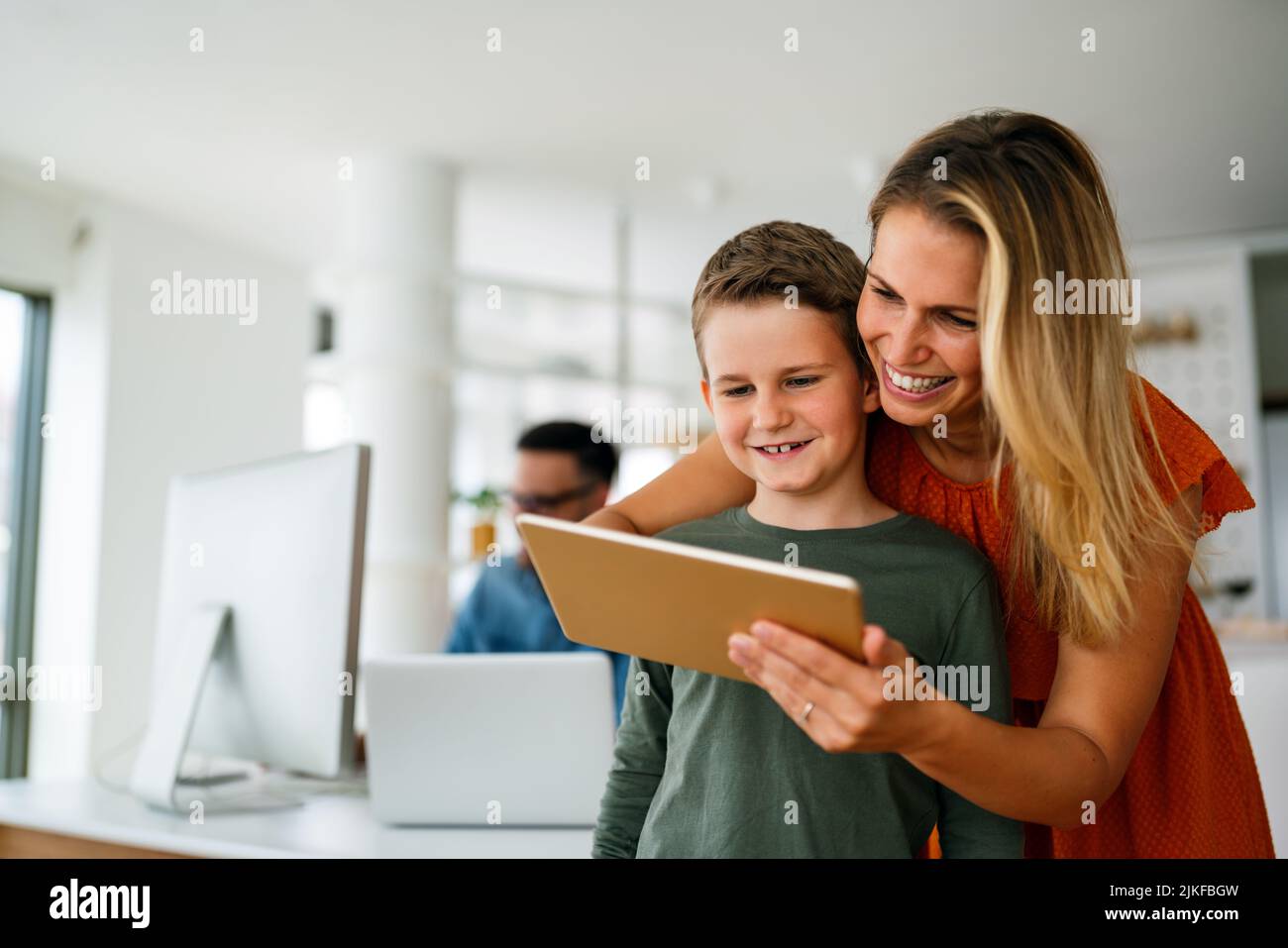 Mother and child using digital tablet for e-learning. Education home ...