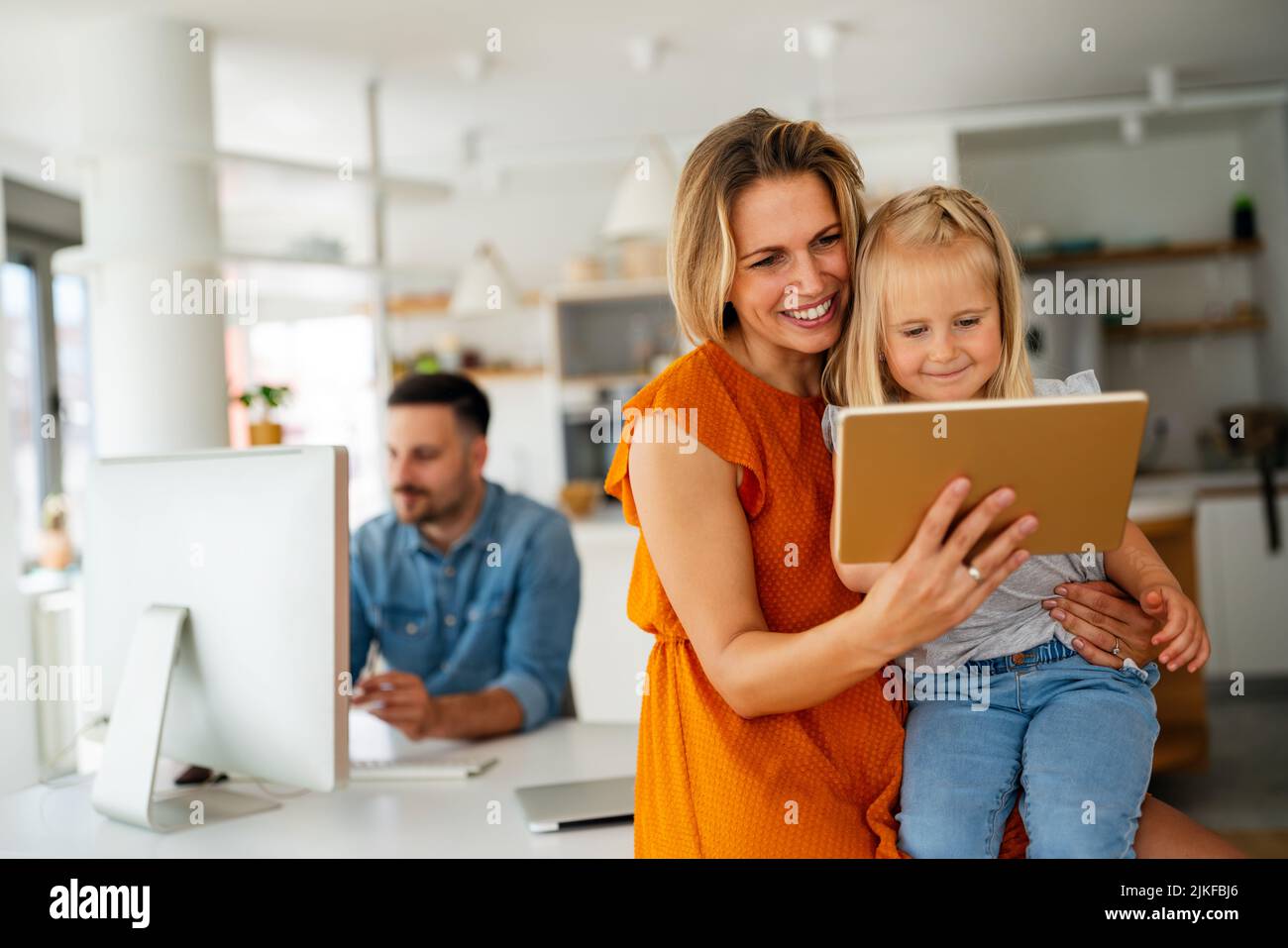 Device technology family online education concept. Happy family with ...