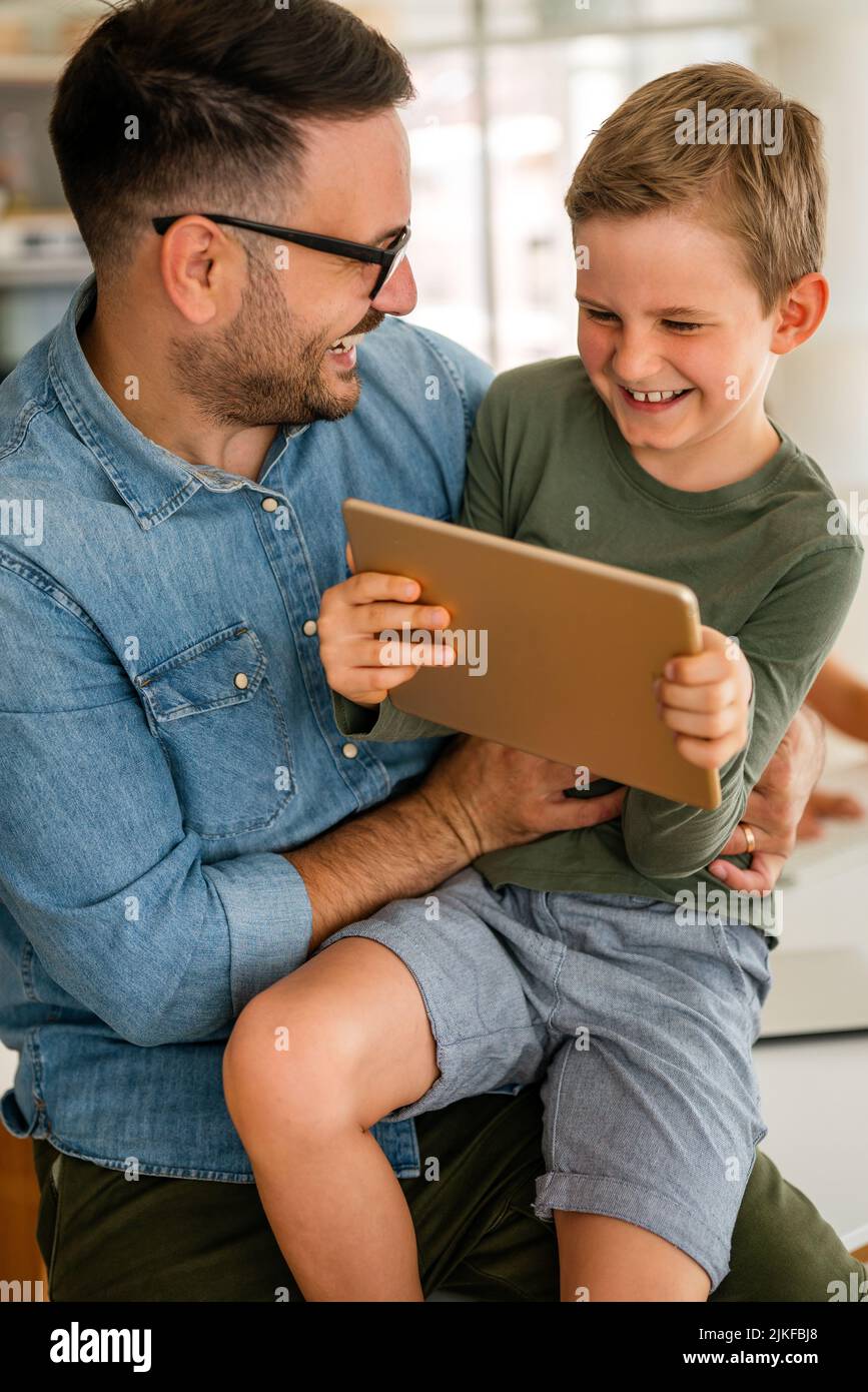 Device technology family online education concept. Happy family with ...