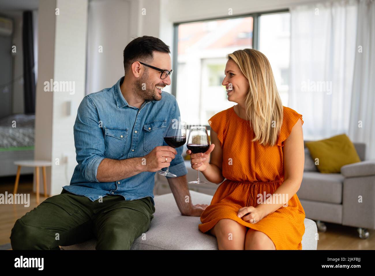 Happy couple having a romantic date and drinking wine. Couple love ...
