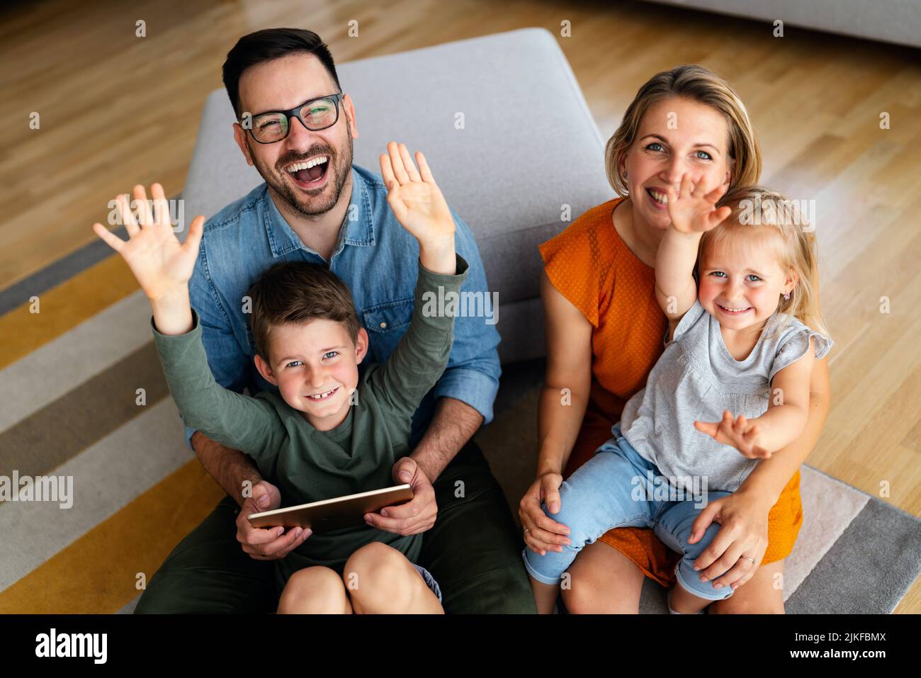 Happy family having fun time at home. Parents playing smiling with ...