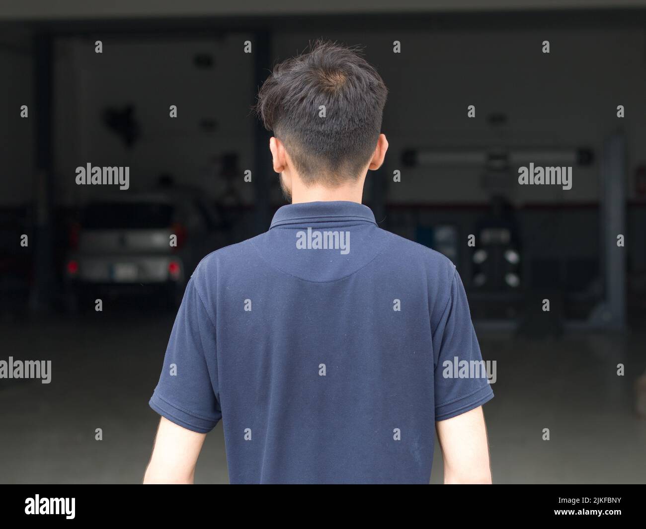 Pakistani or Indian or South Asian Car Mechanic standing outside of ...