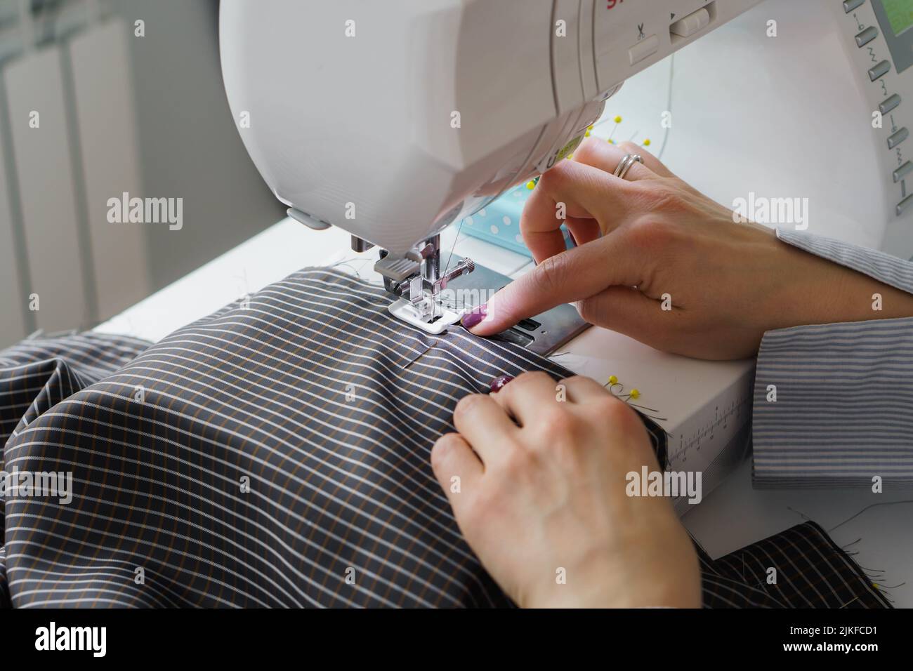 Woman dressmaker works hands hi-res stock photography and images - Alamy