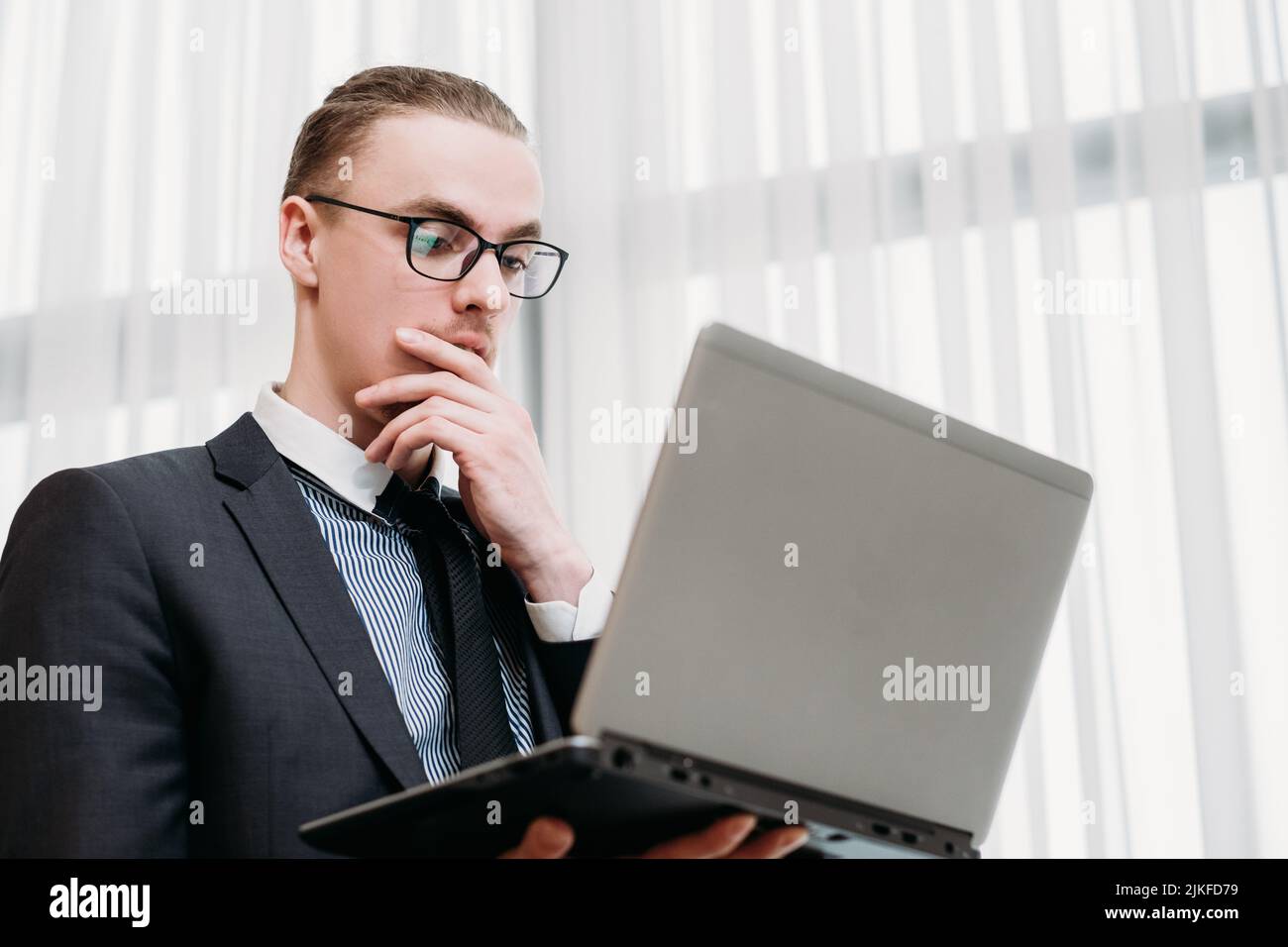 business man focused reading laptop corporate job Stock Photo - Alamy