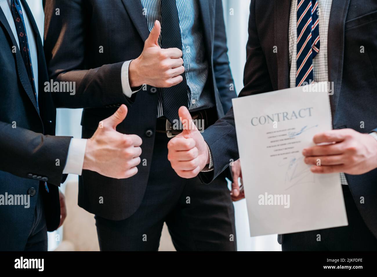 success teamwork deal contract business thumb up Stock Photo - Alamy