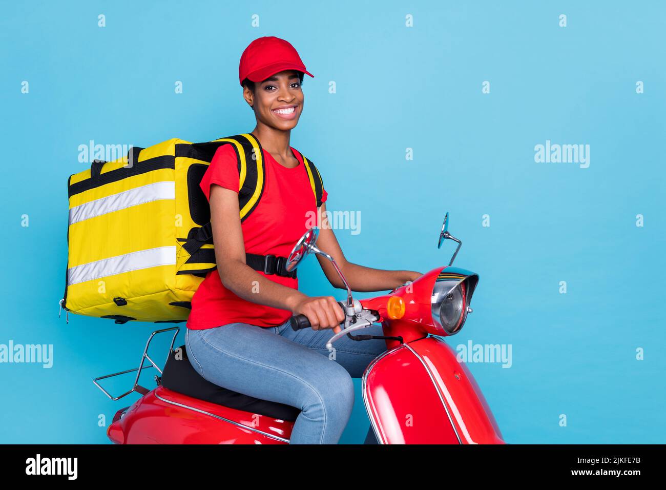 Photo of cheerful friendly person drive bike toothy smile look camera ...