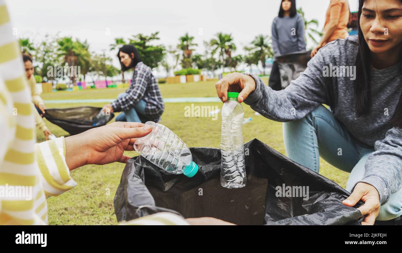 Asia Woman Group Team Volunteer picking up Trash plastics garbage ...