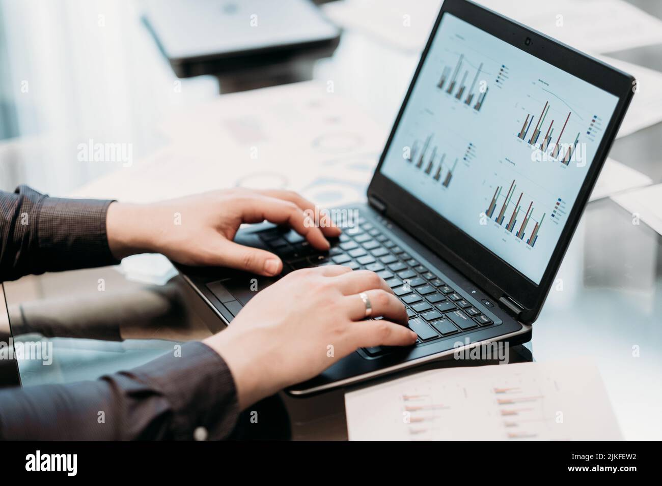 business document hands typing graph screen Stock Photo - Alamy