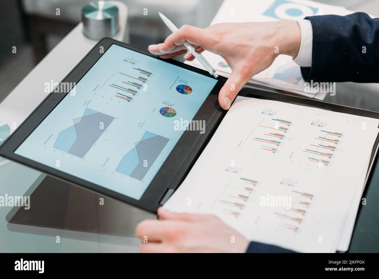 business marketing study data review papers laptop Stock Photo - Alamy