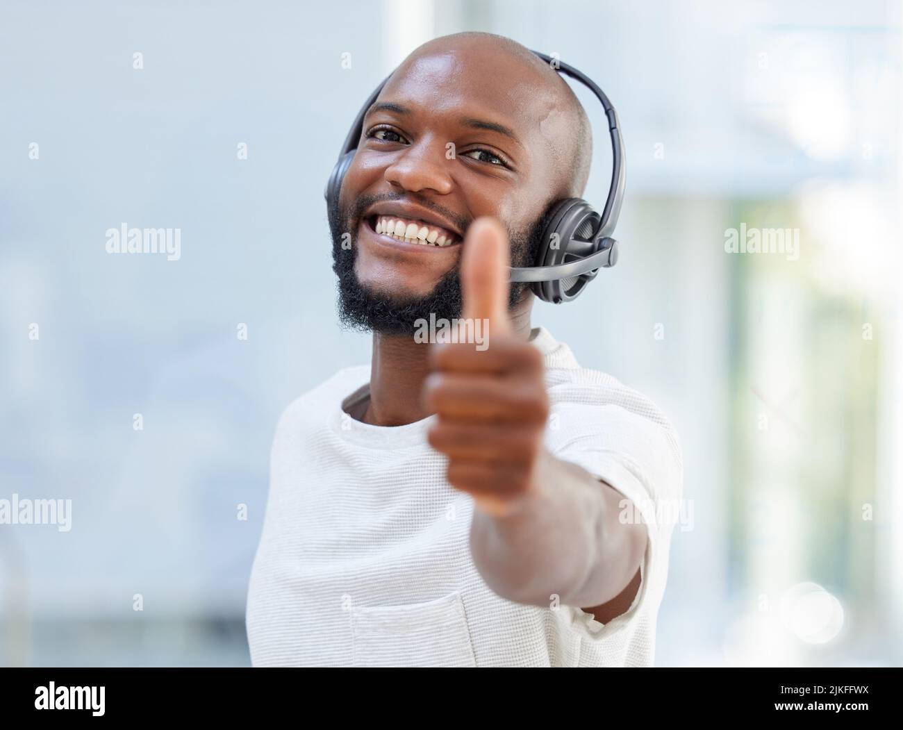 Such a good day is deserves a thumbs up. a young businessman working in ...