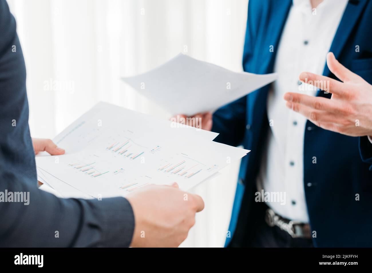 Business people discuss documents hi-res stock photography and images - Alamy