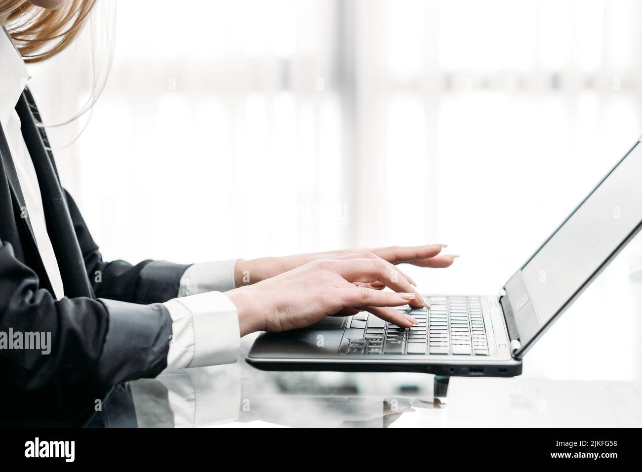 business communication office woman typing laptop Stock Photo - Alamy