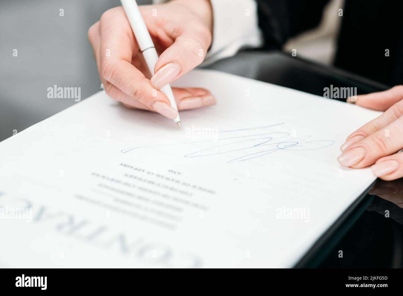 woman hand sign contract closeup business deal Stock Photo - Alamy