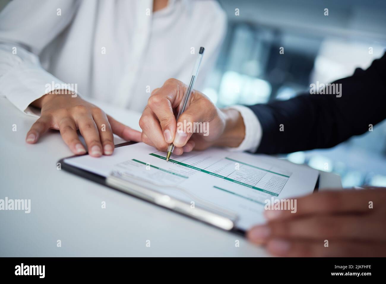 I see some items are missing. two business colleagues filling out ...