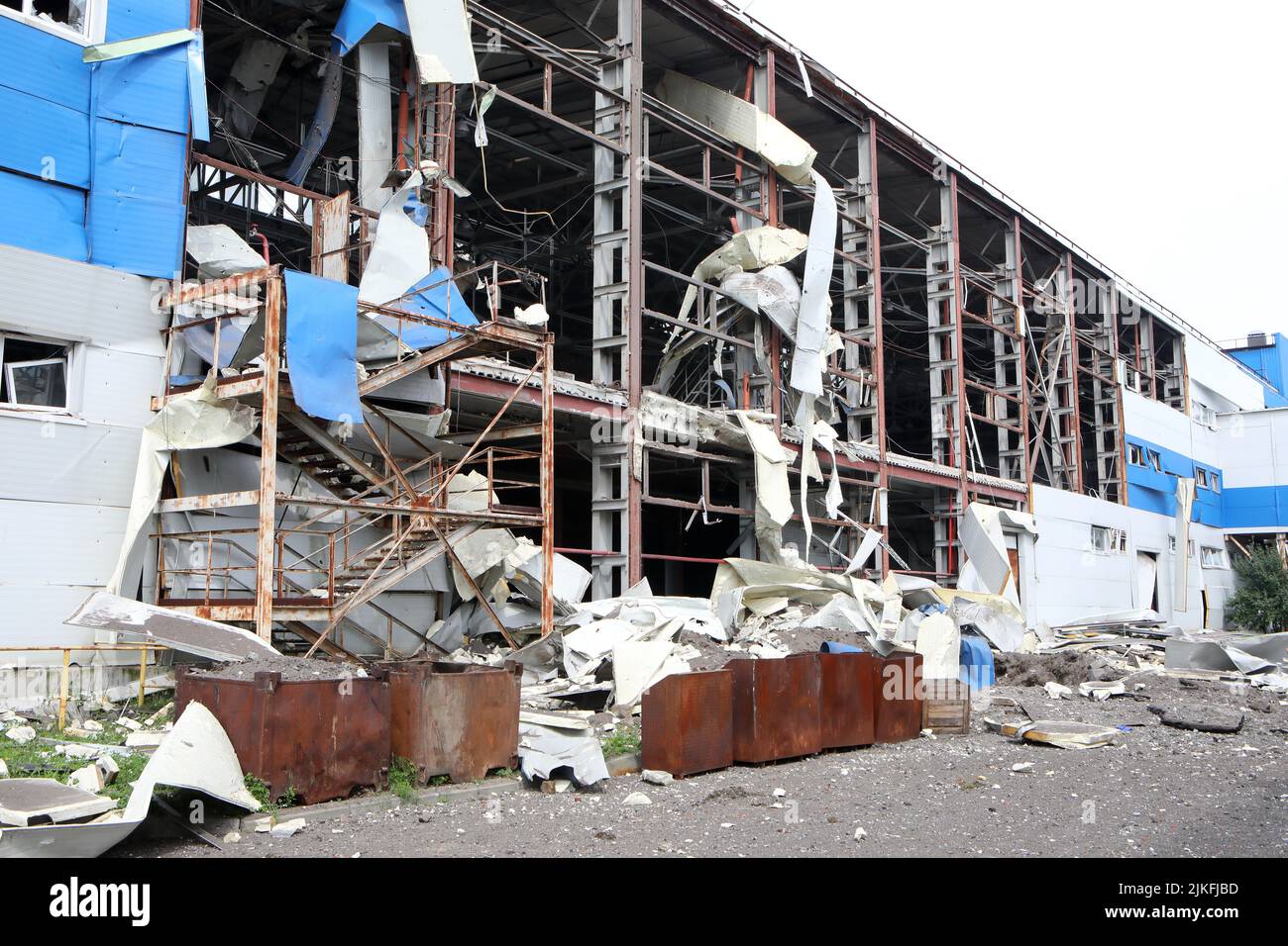 MEREFA, UKRAINE - AUGUST 1, 202 - An industrial enterprise shows damage ...