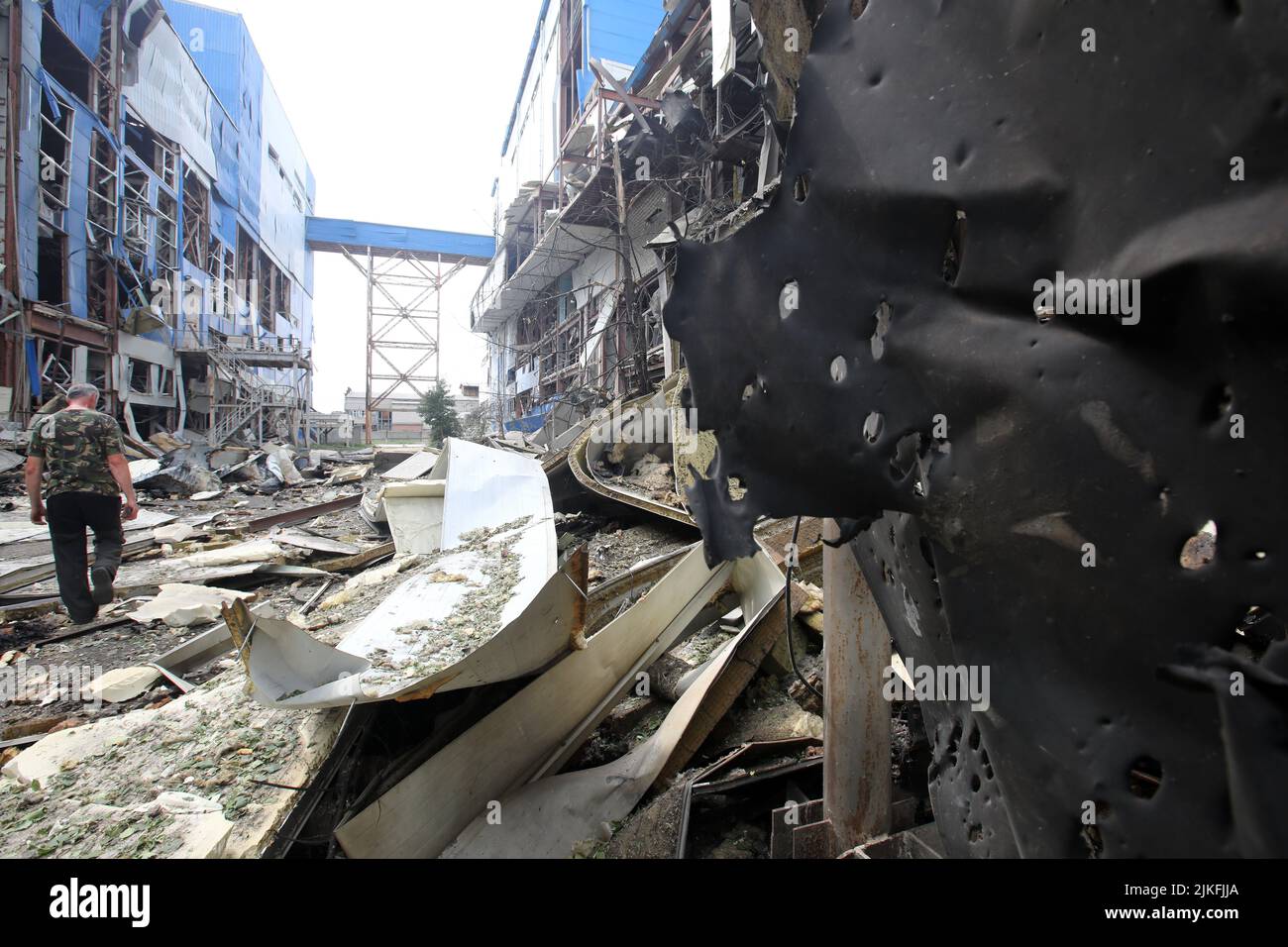 MEREFA, UKRAINE - AUGUST 1, 202 - An industrial enterprise shows damage ...
