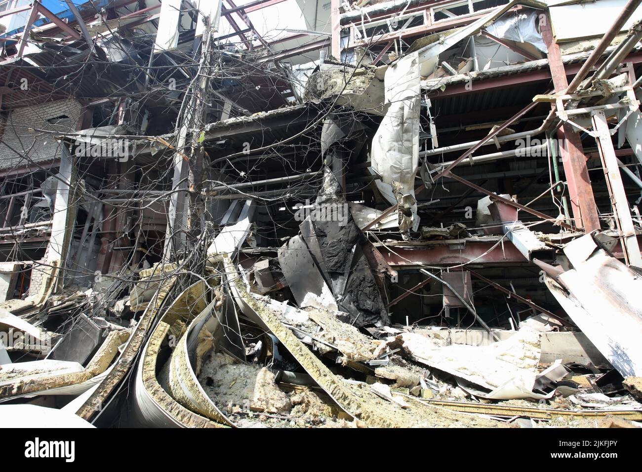 MEREFA, UKRAINE - AUGUST 1, 202 - An industrial enterprise shows damage ...