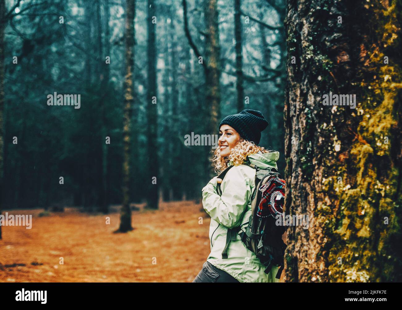 Happy female excursionist enjoy nature background and forest around ...
