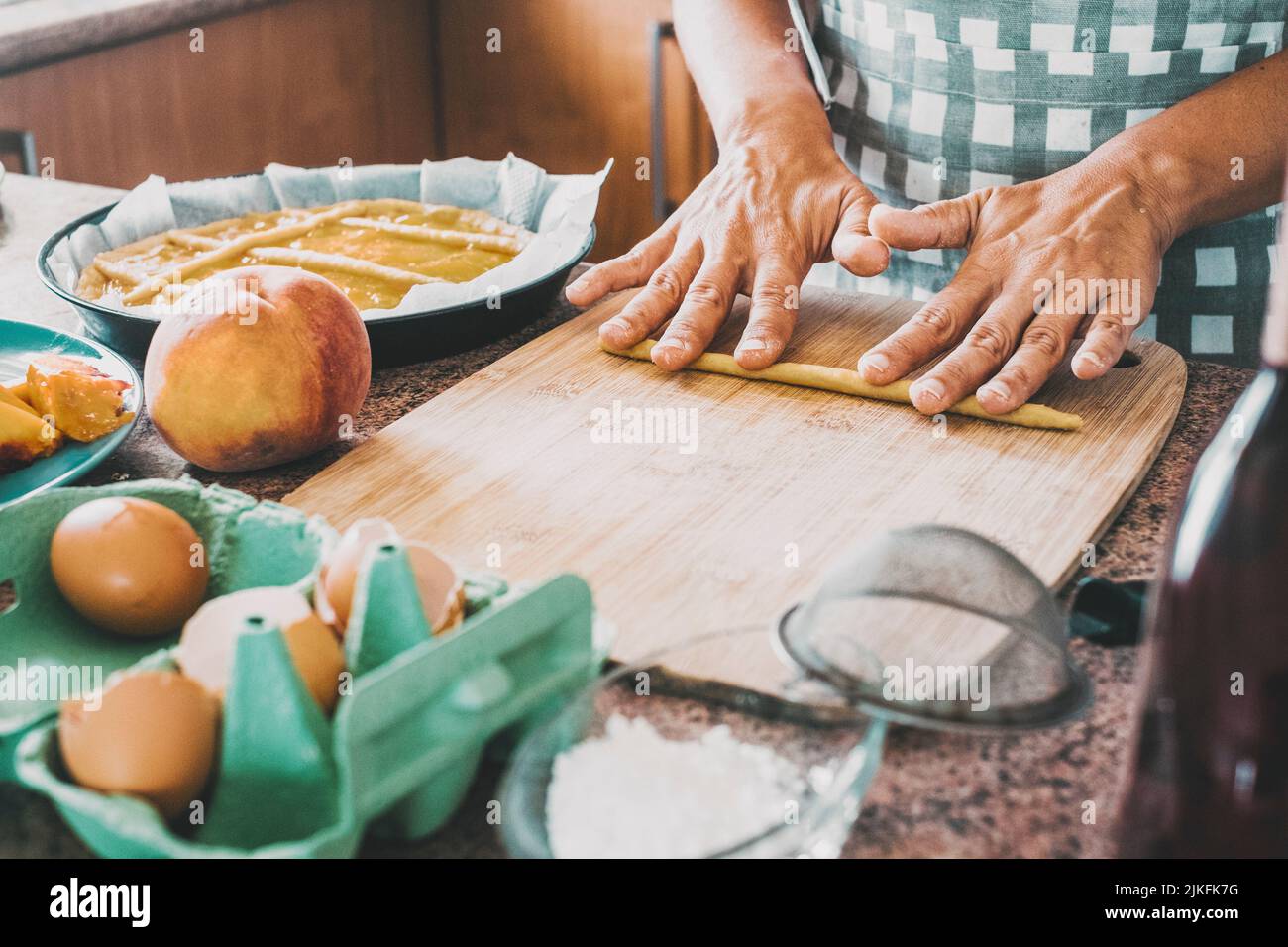 Close up of female working and cooking at home with fresh pasta making ...