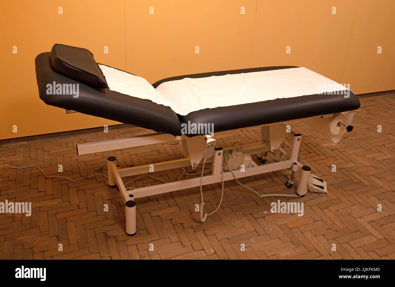 Examination room in a medical clinic, adjustable bed Stock Photo - Alamy