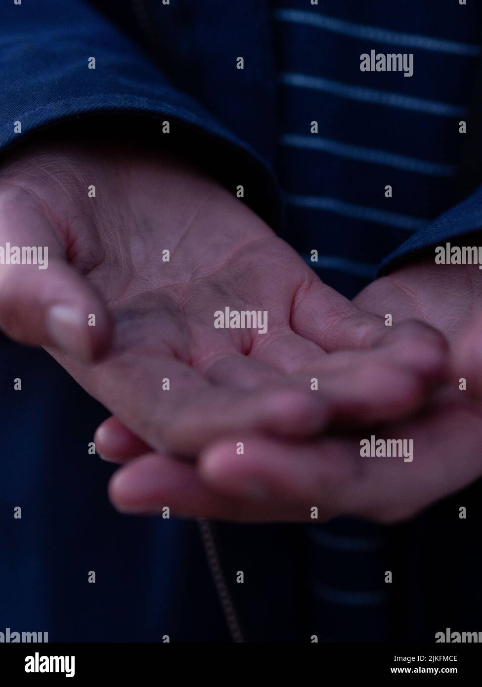 A vertical closeup of dirty hands of a worker man after hard work Stock ...