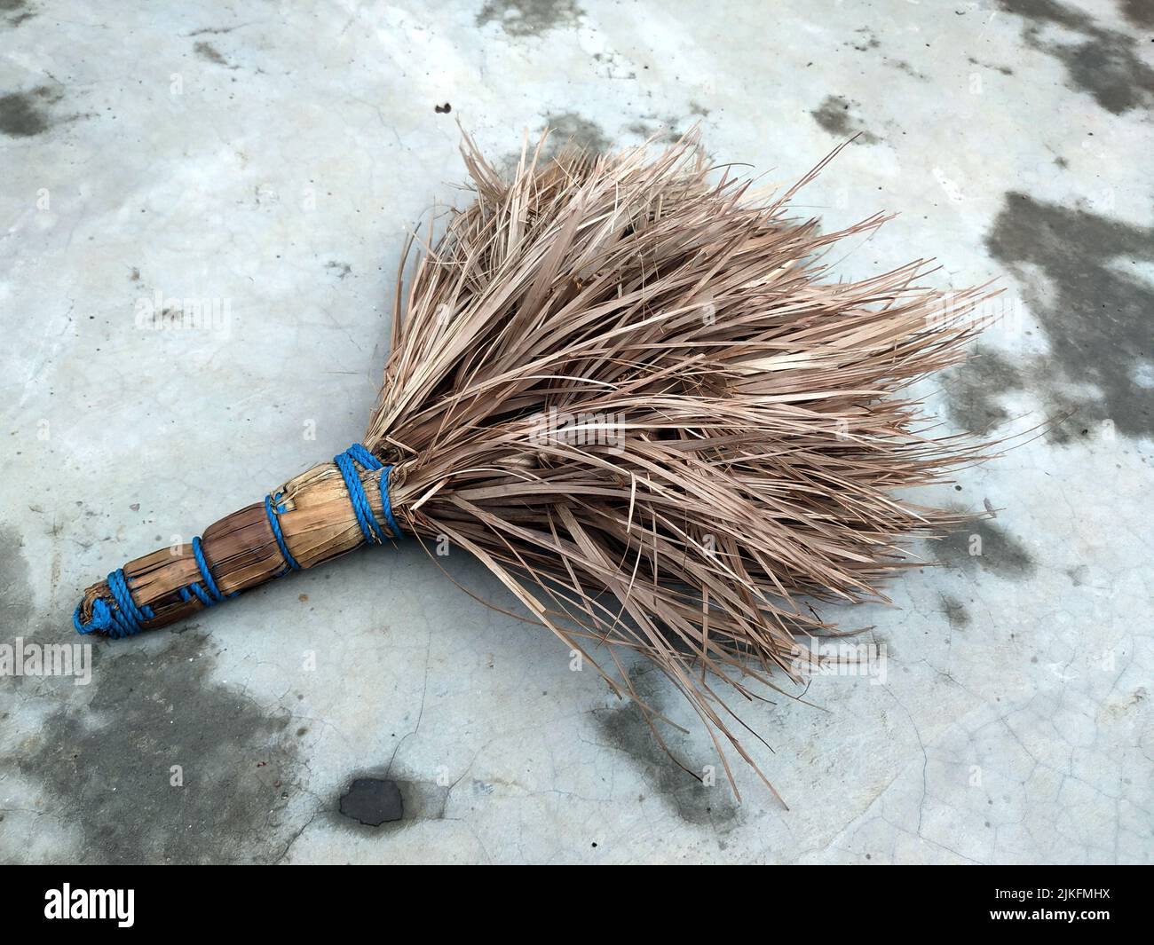 brown brooms put on the ground Stock Photo - Alamy