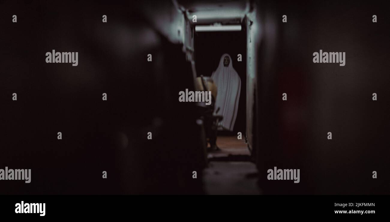 A demon with a skull face is standing in the corridor. Horror ...