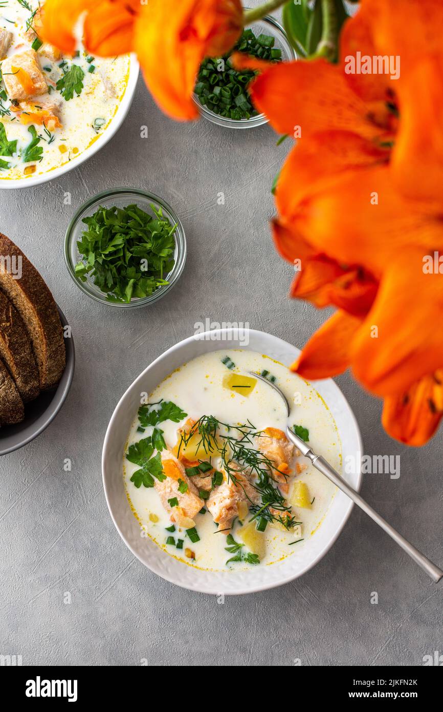 Norwegian salmon red fish soup with vegetables, herbs and cream, top ...